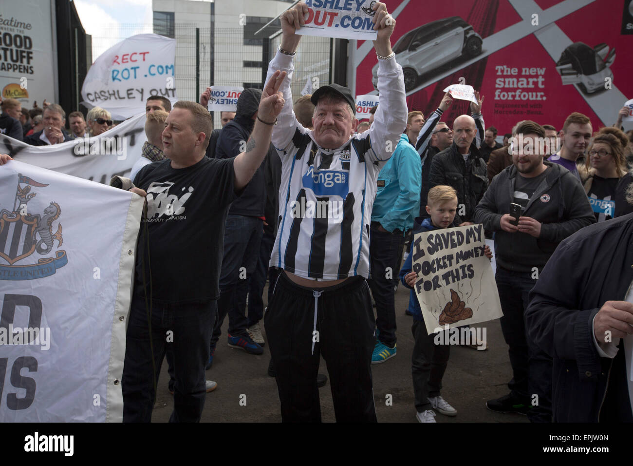 Protesters holding signs and chanting during a demonstration at the ...