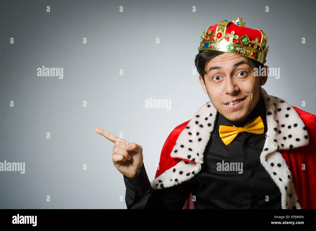 Concept with funny man wearing crown Stock Photo - Alamy