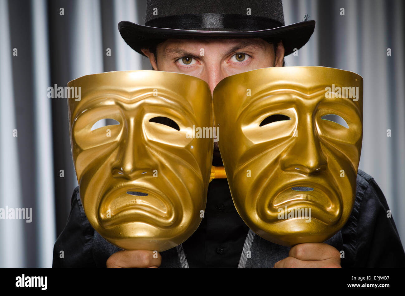 Funny concept with theatrical mask Stock Photo - Alamy