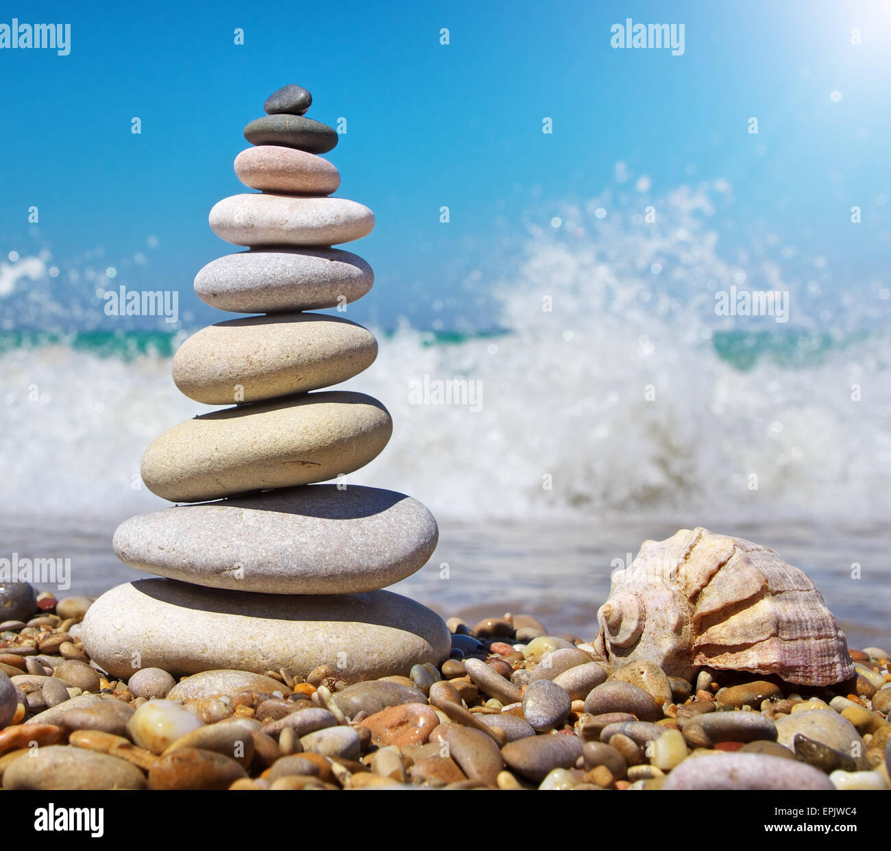 Stone pyramid on a seashore. Relax composition Stock Photo - Alamy