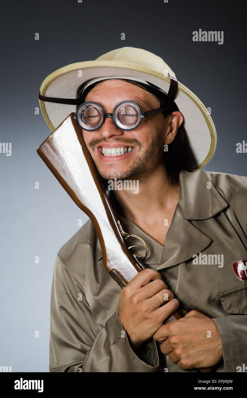 Funny safari hunter with rifle Stock Photo - Alamy