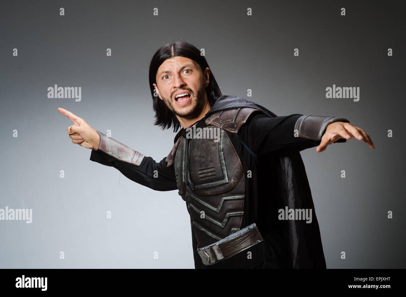 Funny knight against dark background Stock Photo - Alamy