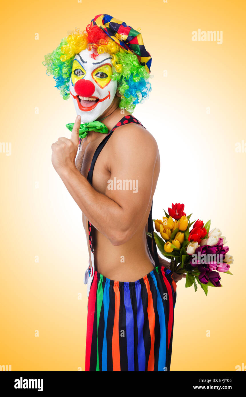 Clown with flowers on white Stock Photo - Alamy