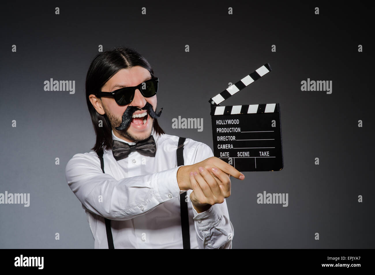 Funny man with movie clapboard Stock Photo - Alamy