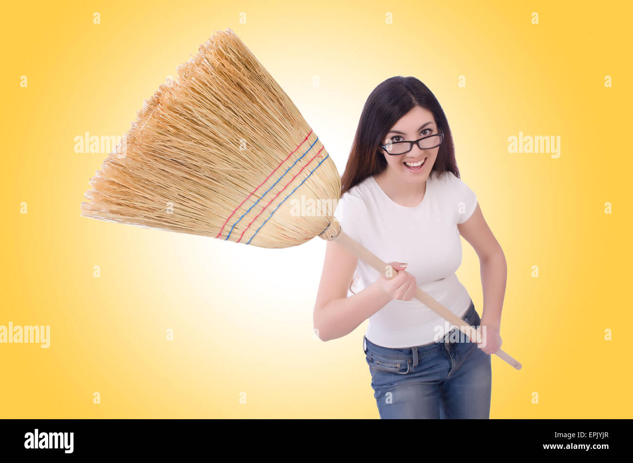 Young woman with broom on white Stock Photo - Alamy