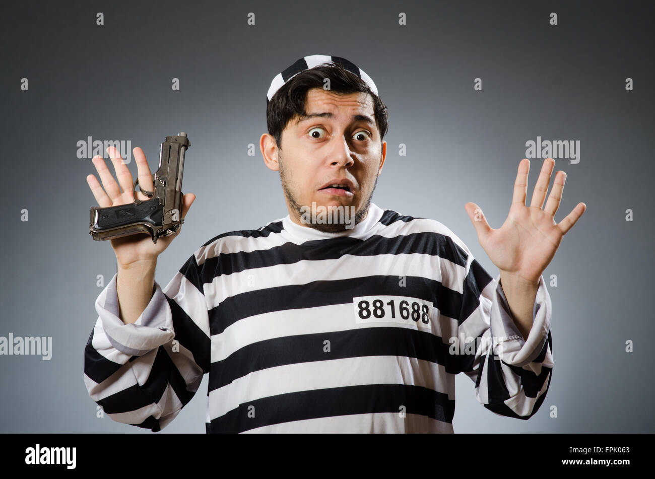 Funny prison inmate with gun Stock Photo - Alamy