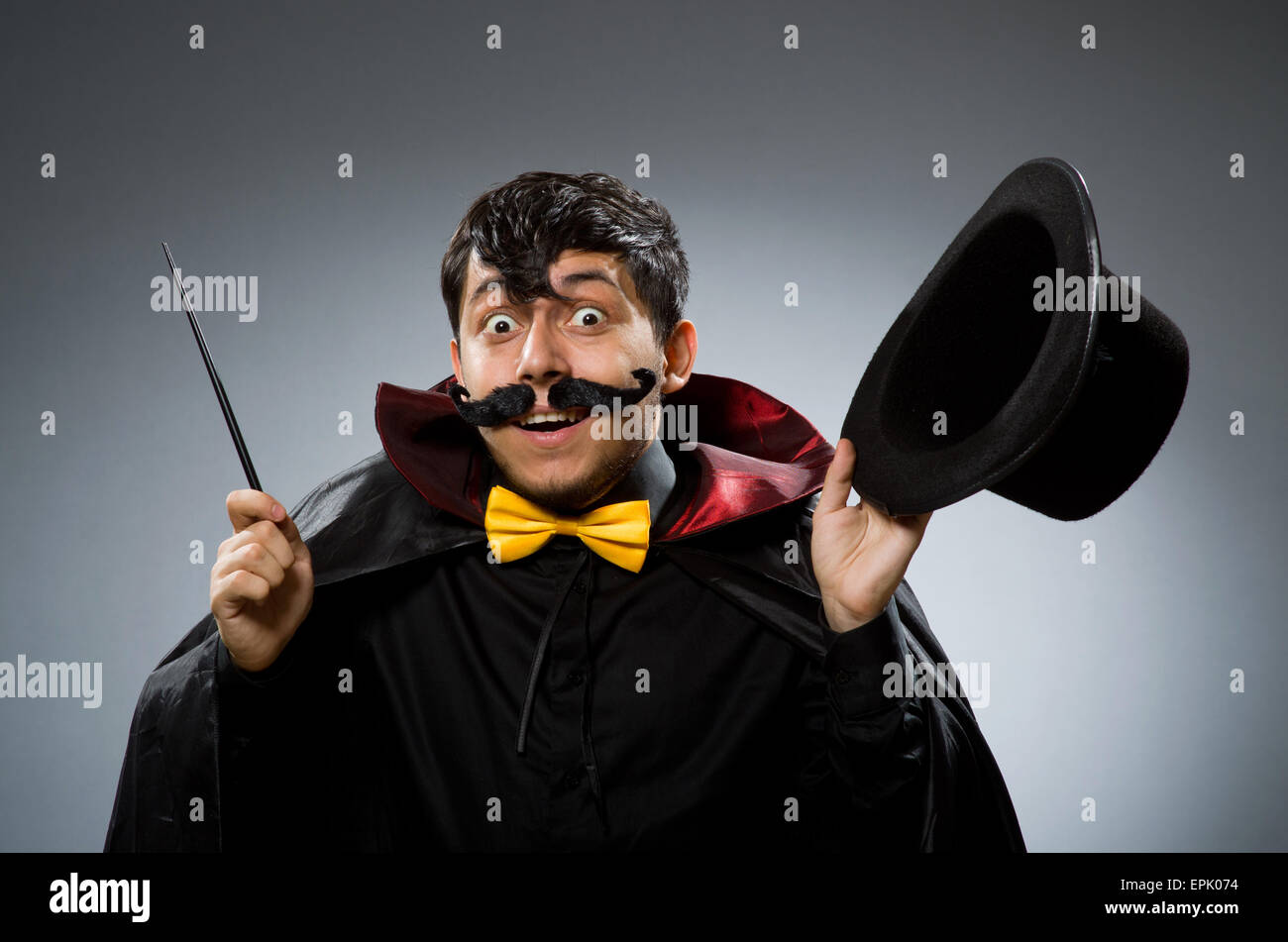 Funny magician man with wand and hat Stock Photo - Alamy