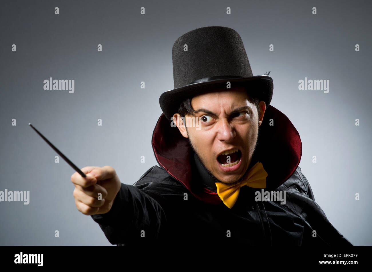 Funny magician man with wand and hat Stock Photo - Alamy