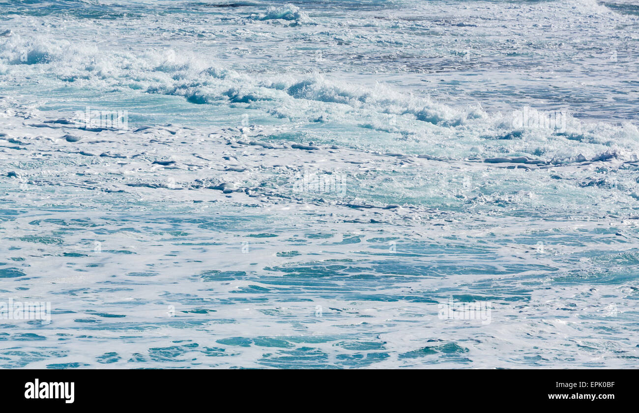 Rows of waves coming to shore Stock Photo - Alamy
