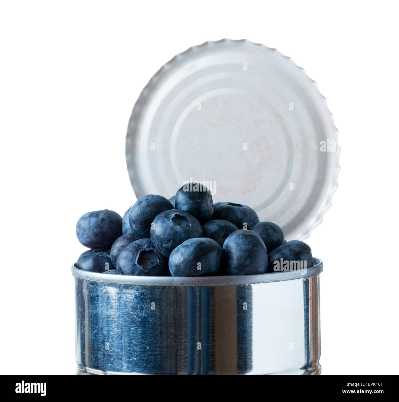 Blueberries bursting out of tin can Stock Photo - Alamy