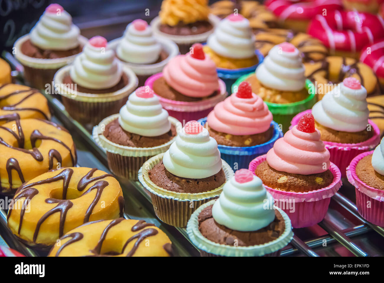 Sweet donuts arranged at display Stock Photo - Alamy