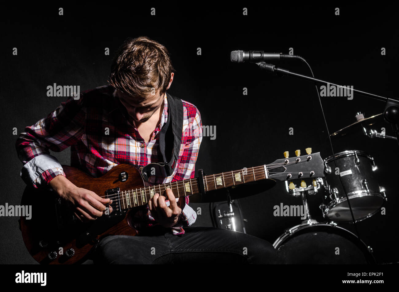 Man with guitar during concert Stock Photo - Alamy