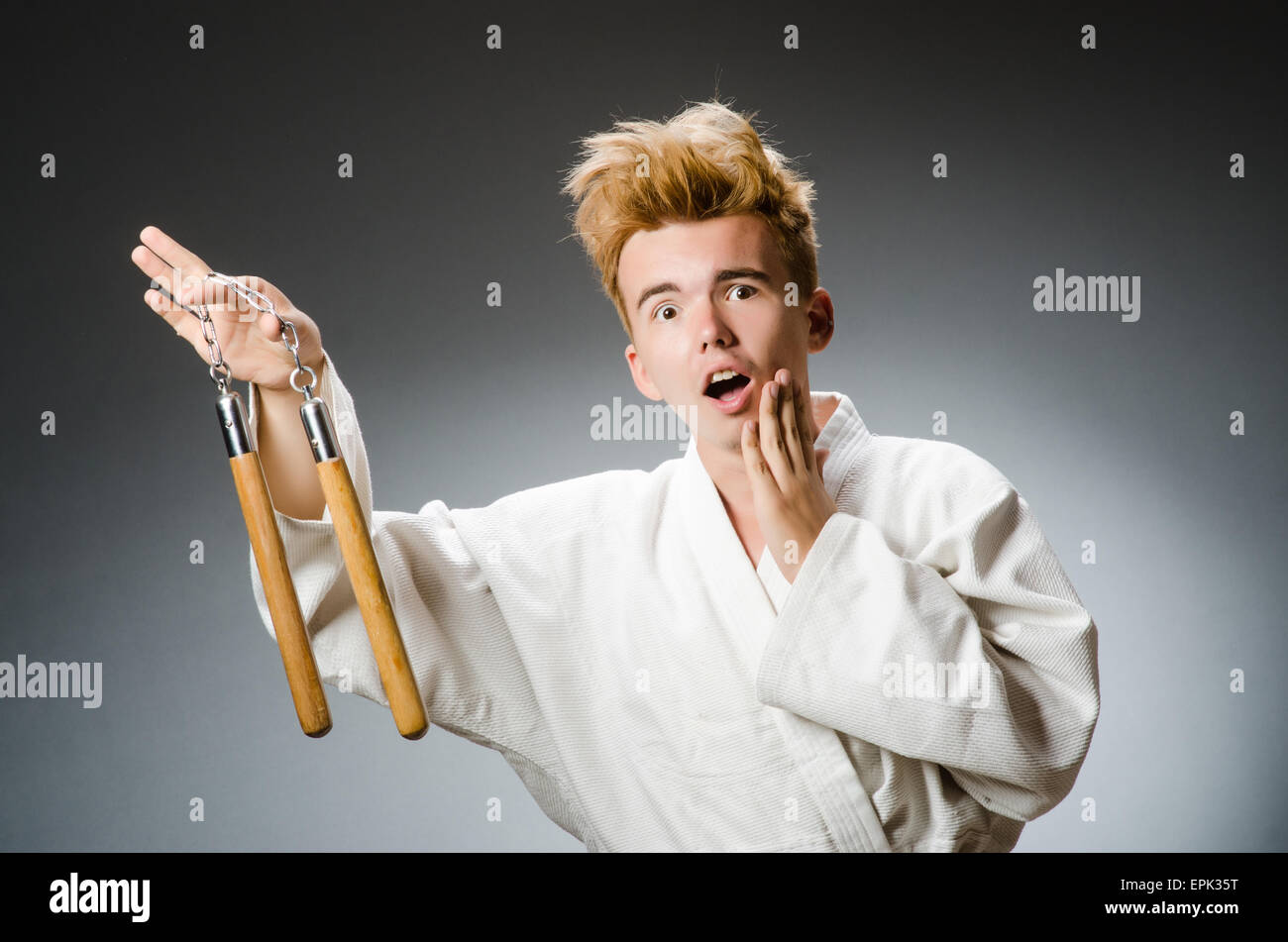 Funny karate fighter with nunchucks Stock Photo - Alamy