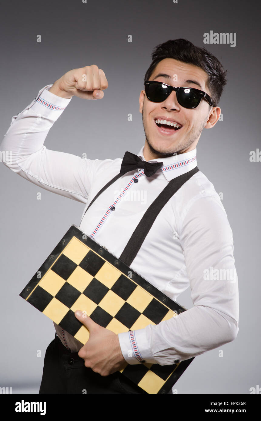 Funny chess player with board Stock Photo - Alamy
