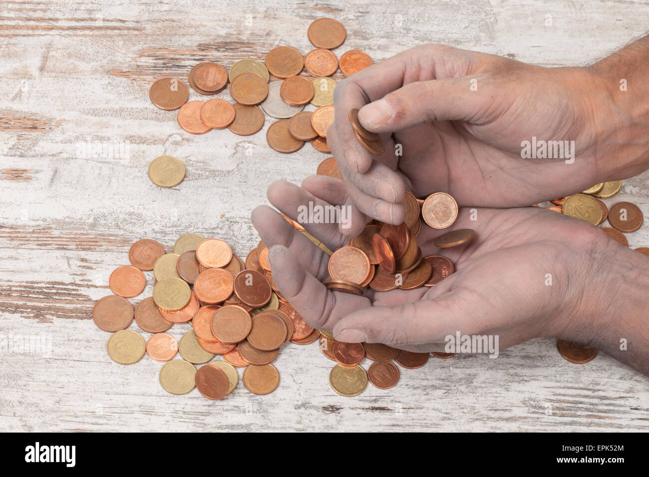 a poor hands taking some coins Stock Photo - Alamy