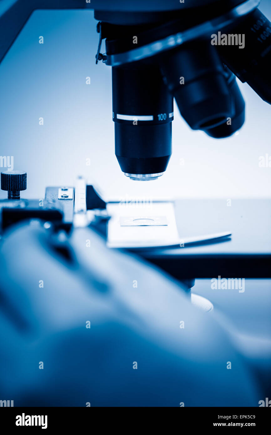 Lab researcher working microscope in hi-res stock photography and ...