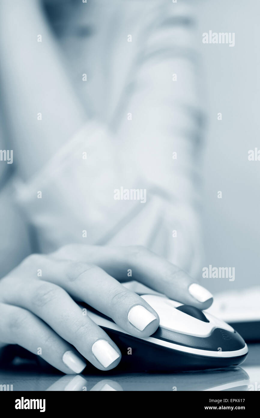 Woman using computer mouse Stock Photo - Alamy