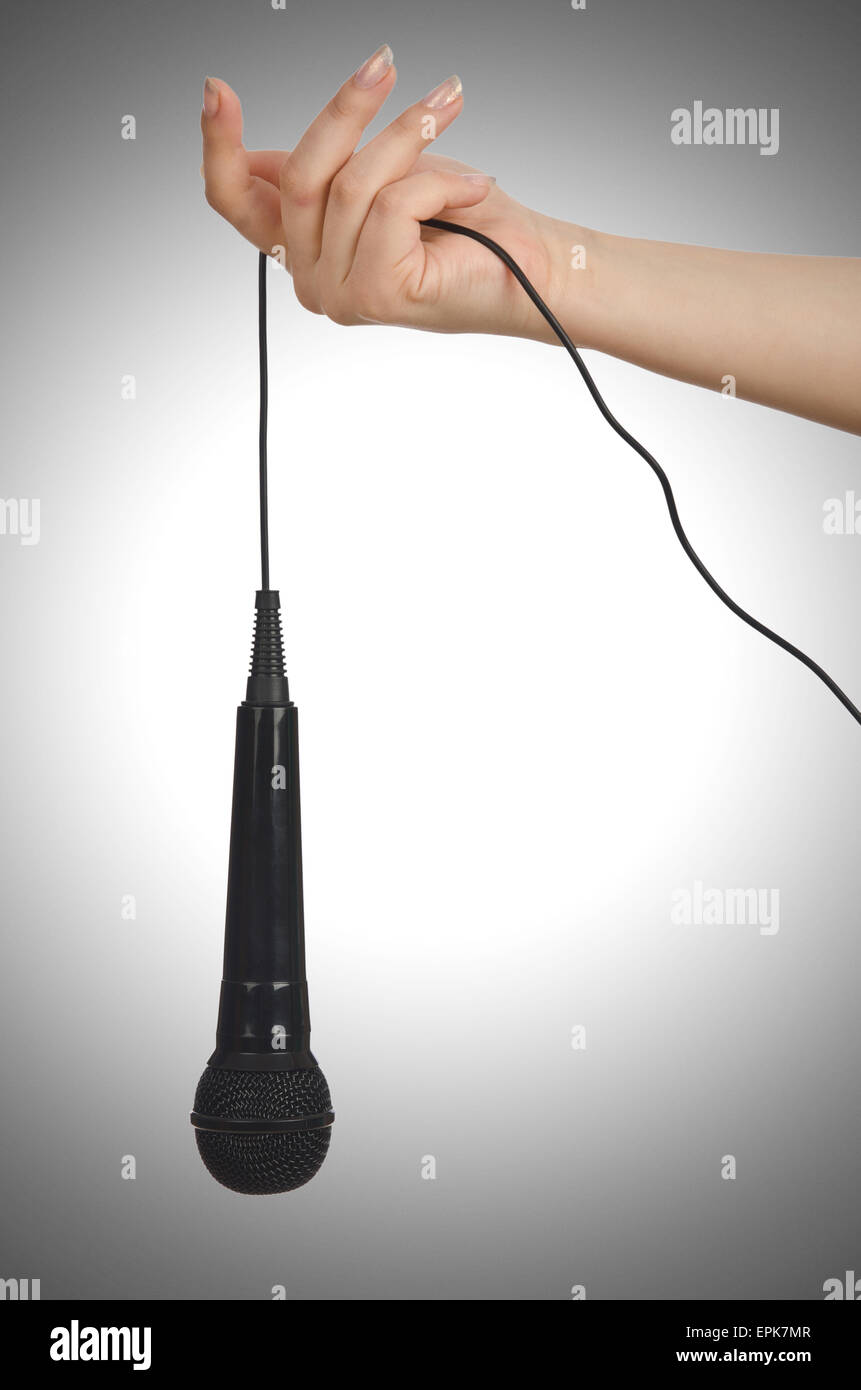 Hand with microphone on white Stock Photo - Alamy