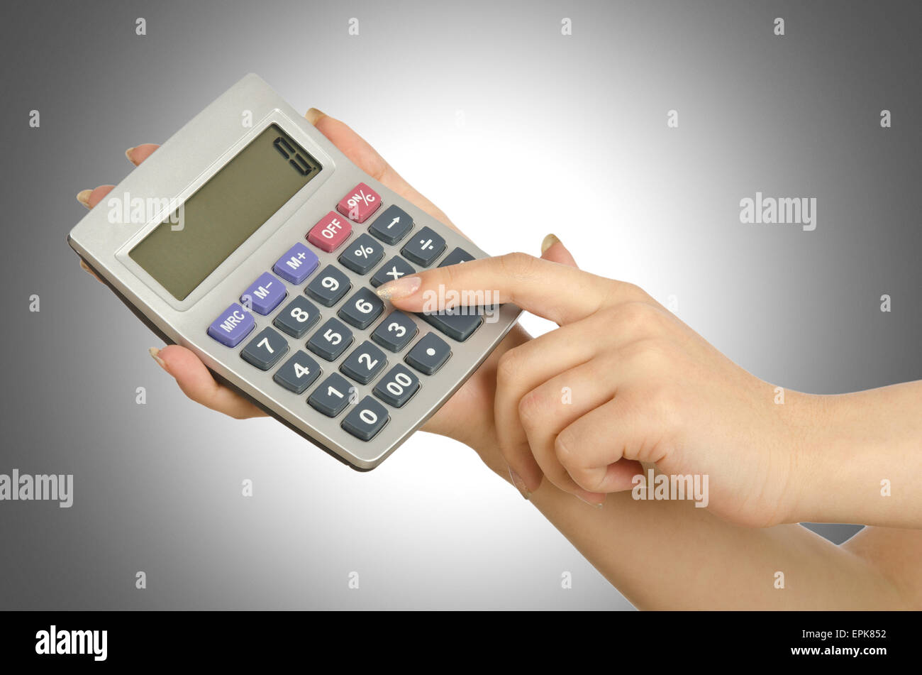 Hand holding calculator on white Stock Photo - Alamy
