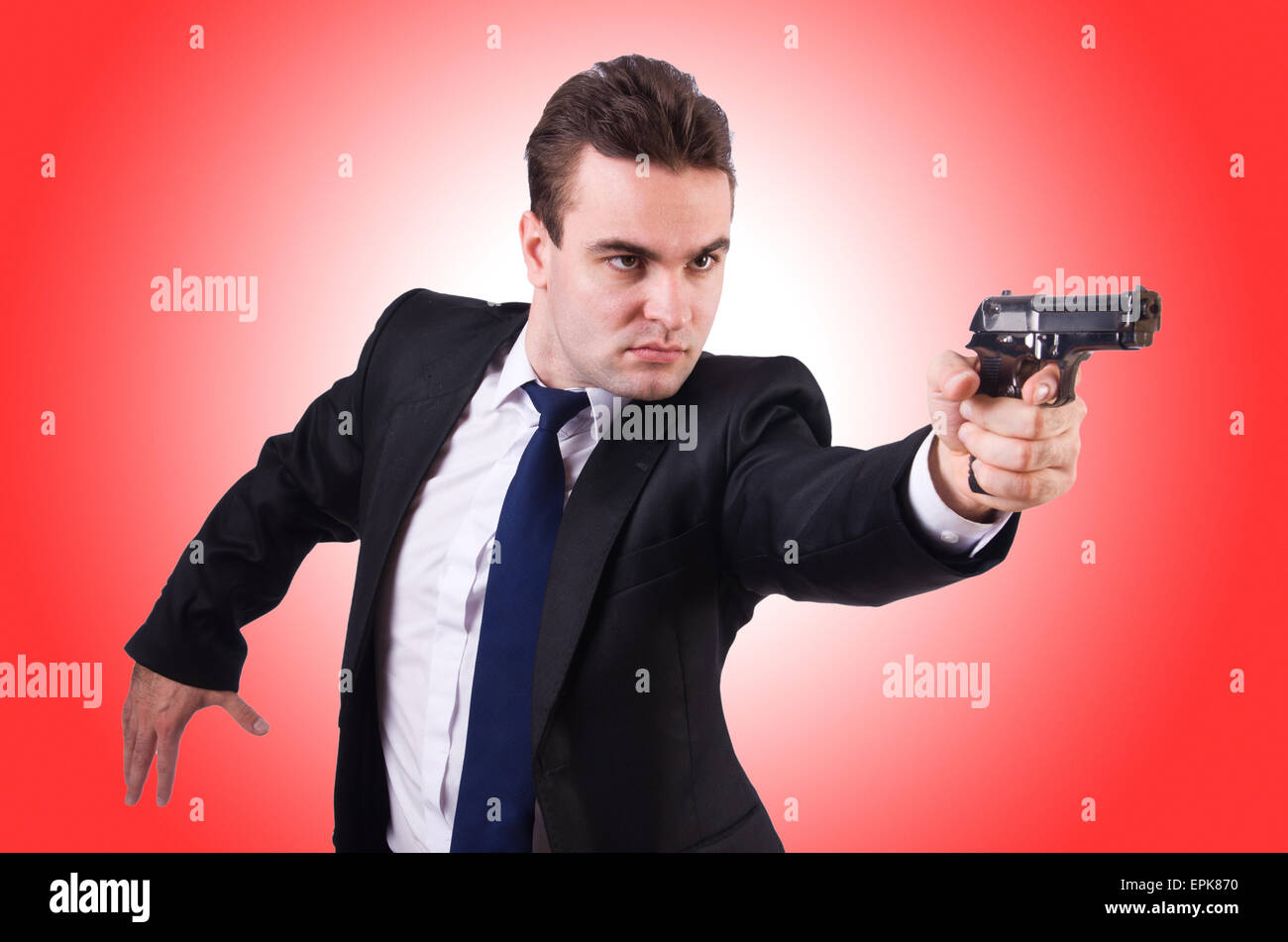 Businessman with gun isolated on white Stock Photo - Alamy