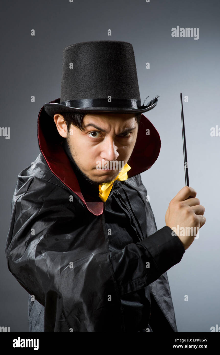 Funny magician man with wand and hat Stock Photo - Alamy