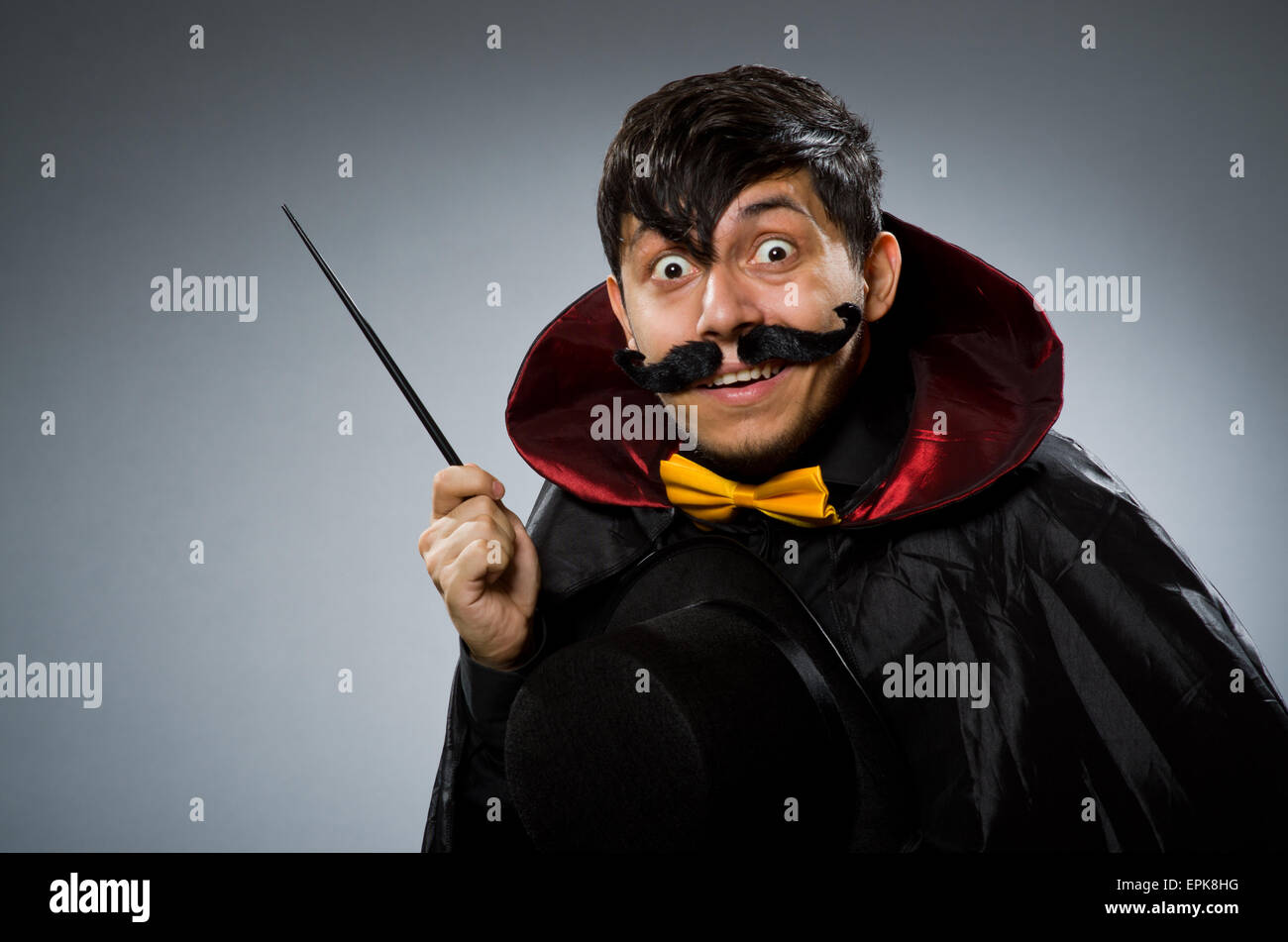 Funny magician man with wand and hat Stock Photo - Alamy