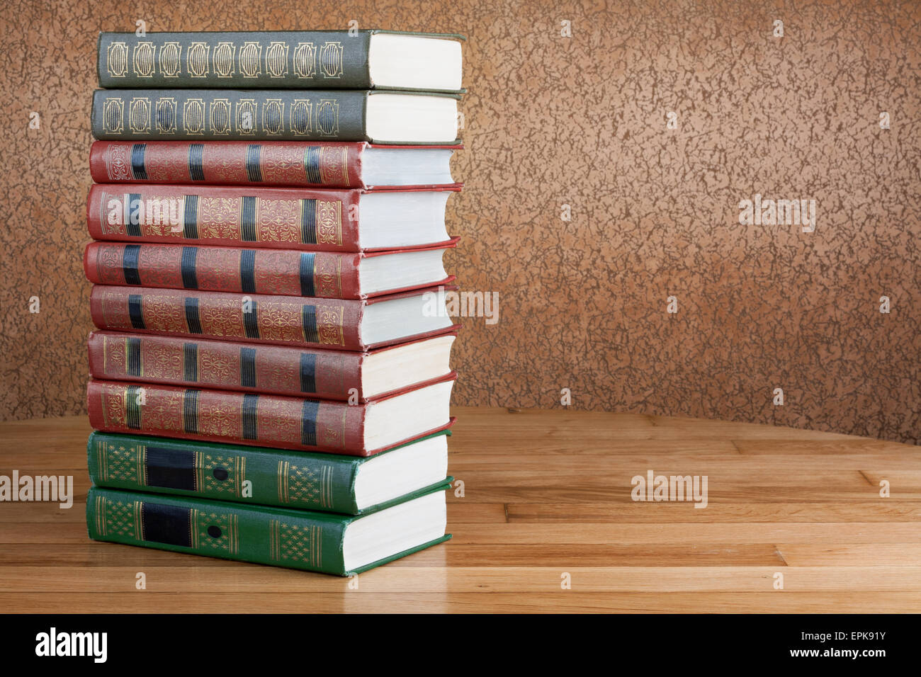 Richly decorated volumes of books with a gold lettering on the ...