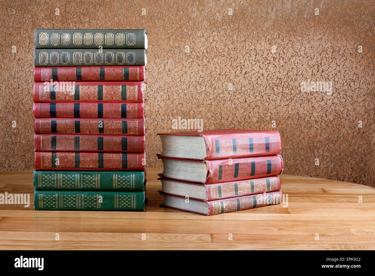 Richly decorated volumes of books with a gold lettering on the ...