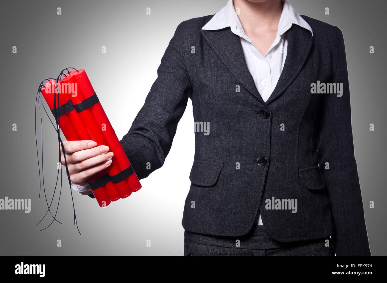 Hand holding bars of dynamite on white Stock Photo - Alamy