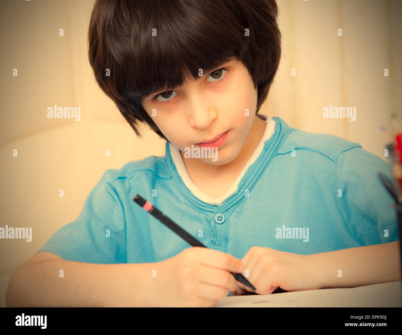 schoolboy doing homework Stock Photo - Alamy
