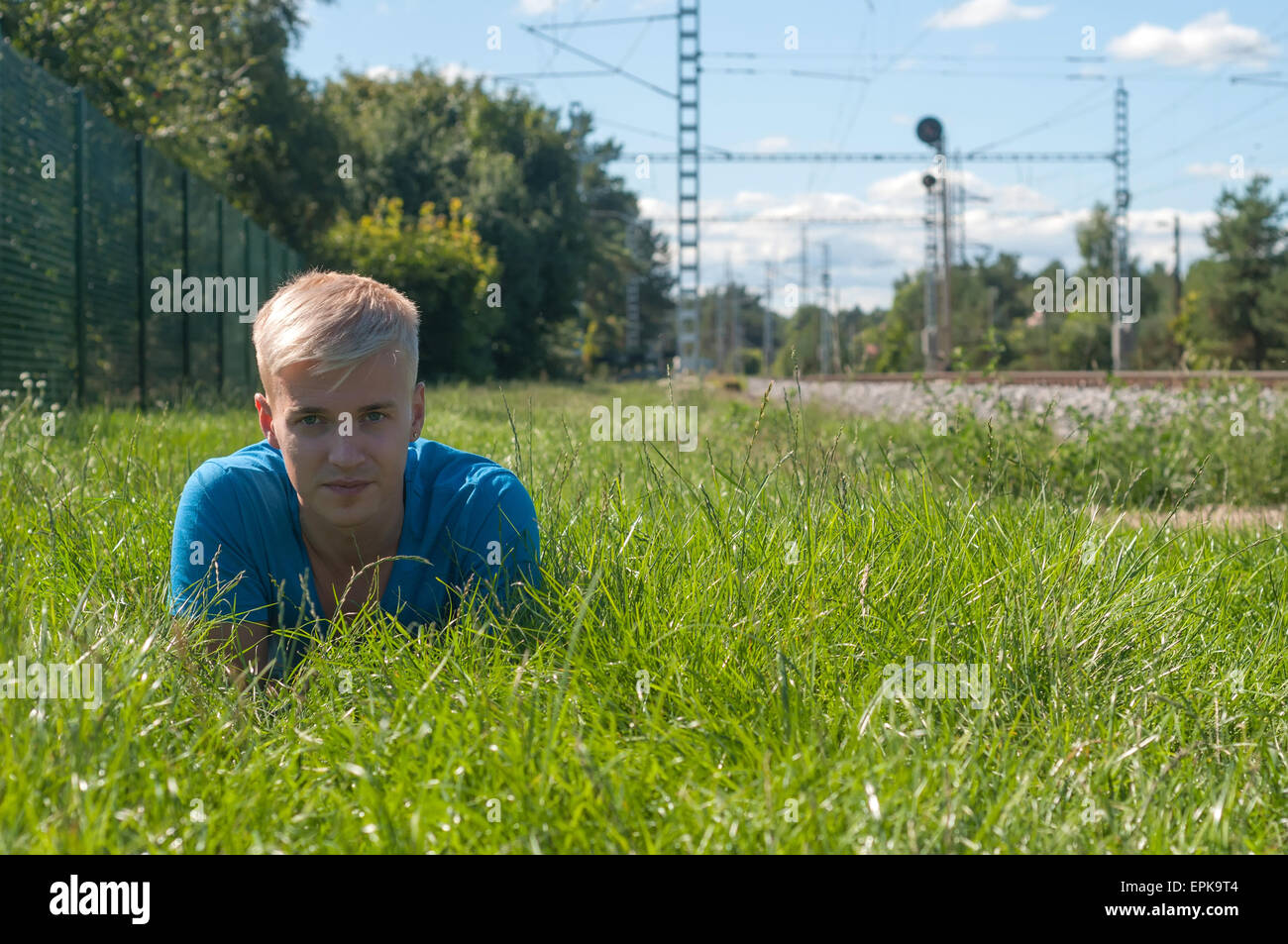 Man lying on grass in hi-res stock photography and images - Alamy
