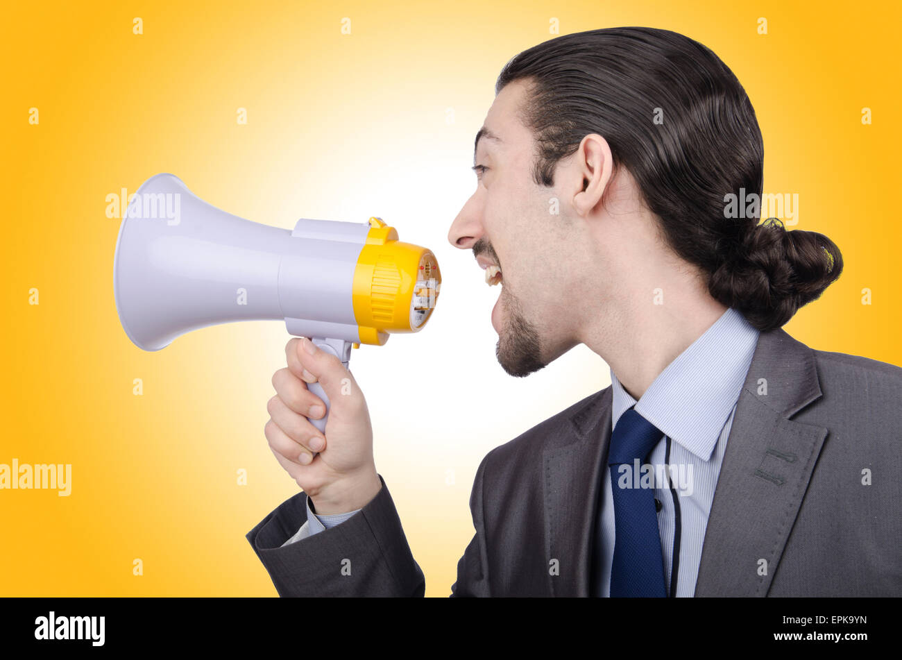 Man shouting and yelling with loudspeaker Stock Photo - Alamy