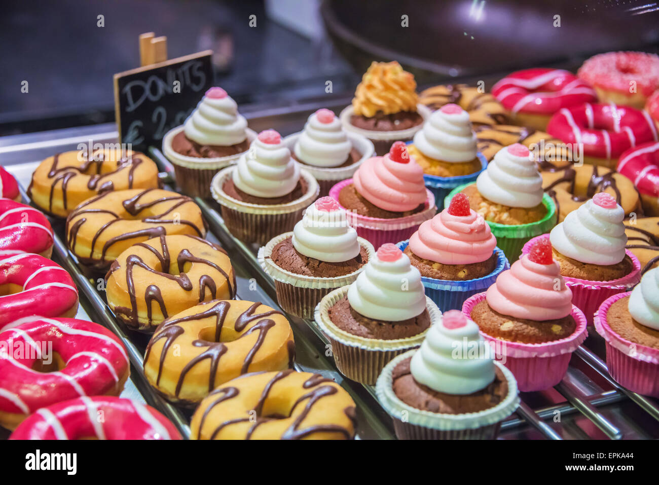 Sweet donuts arranged at display Stock Photo - Alamy