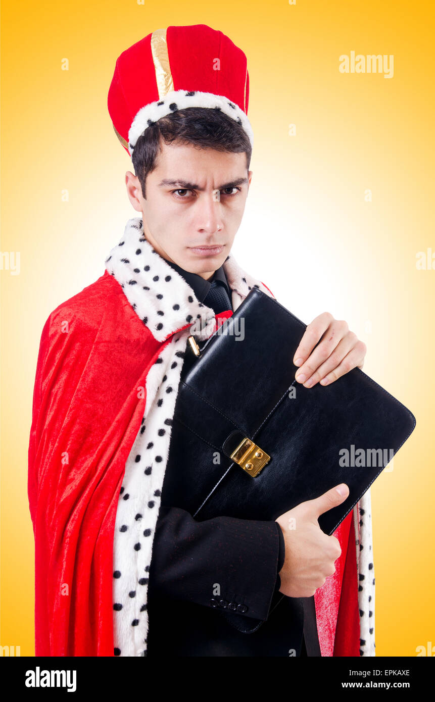 Businessman playing king isolated on white Stock Photo - Alamy
