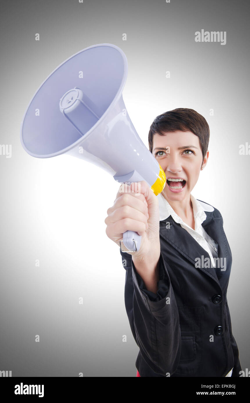 Young business lady screaming to loudspeaker Stock Photo - Alamy