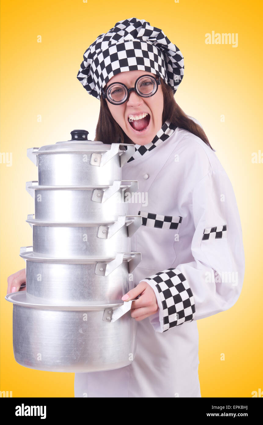 Cook with stack of pots on white Stock Photo - Alamy