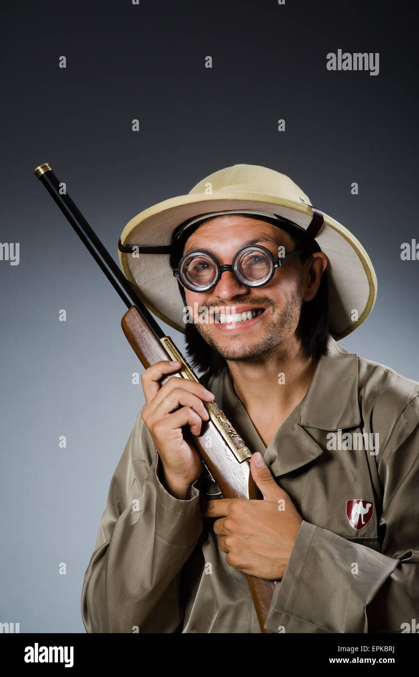 Funny safari hunter with rifle Stock Photo - Alamy