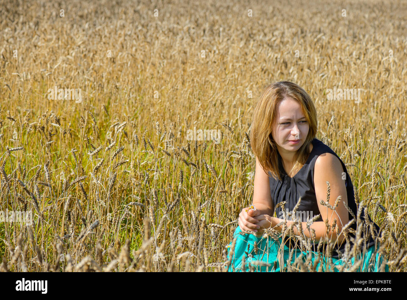 Portrait of woman in field Stock Photo - Alamy