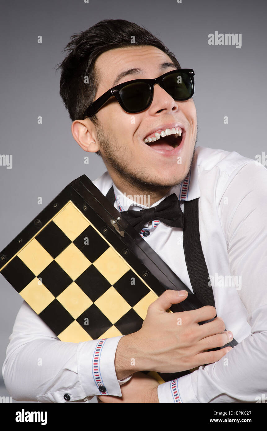 Funny chess player with board Stock Photo - Alamy