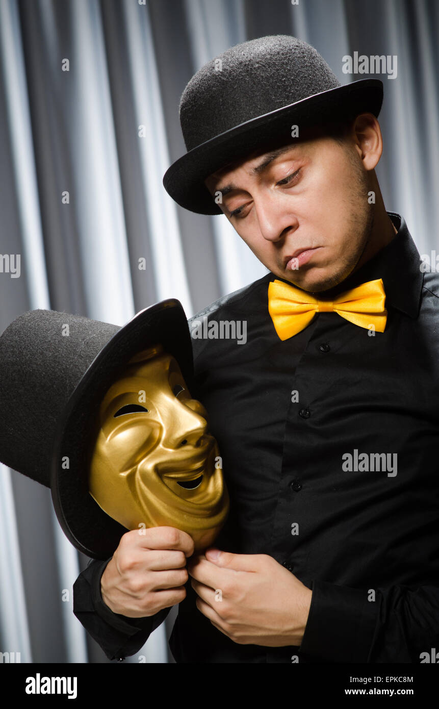 Funny concept with theatrical mask Stock Photo - Alamy