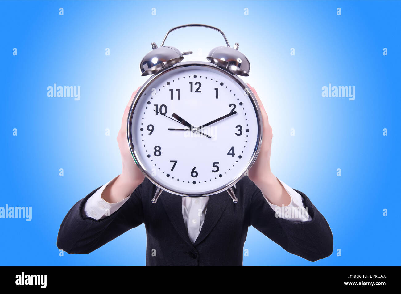 Funny woman with clock on white Stock Photo - Alamy