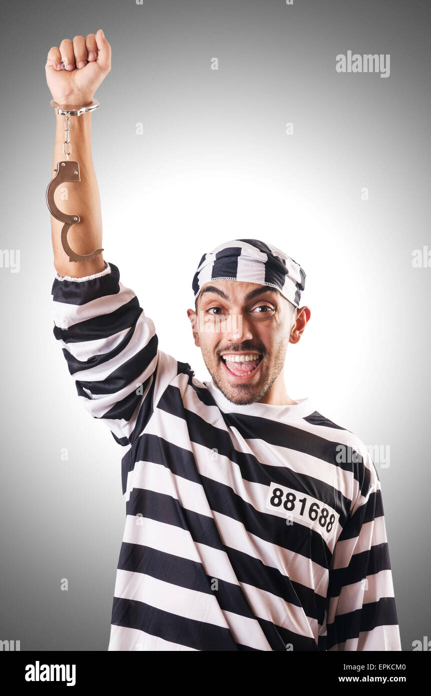 Convict criminal in striped uniform Stock Photo - Alamy