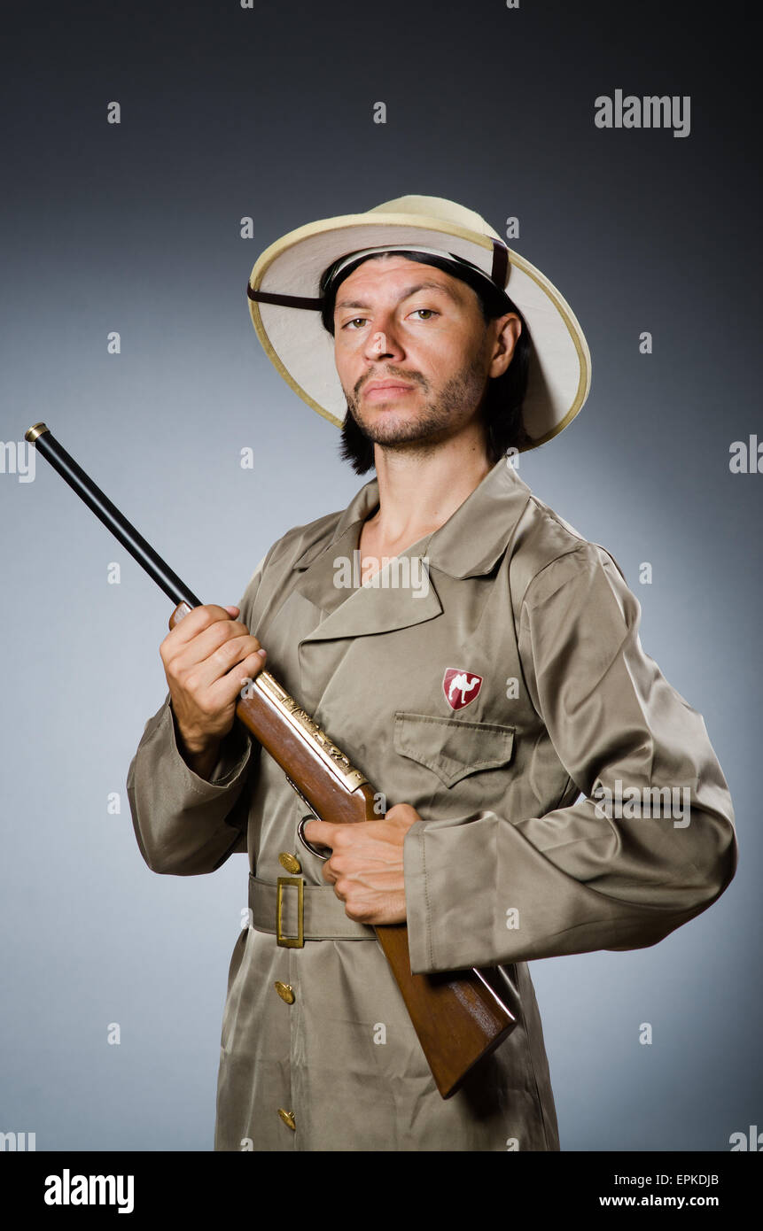 Funny safari hunter with rifle Stock Photo - Alamy