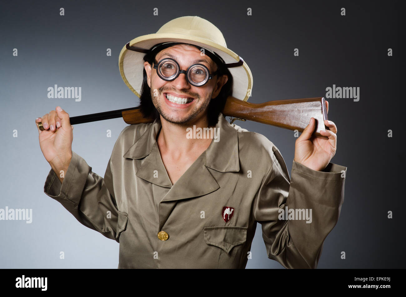 Funny safari hunter with rifle Stock Photo - Alamy