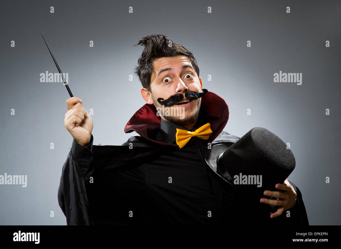Funny magician man with wand and hat Stock Photo - Alamy