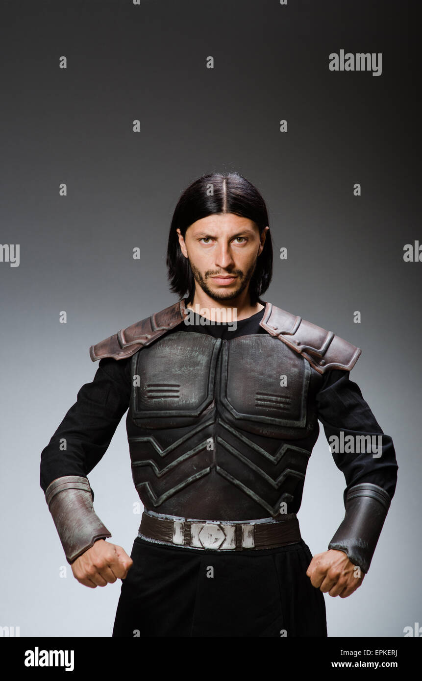 Angry warrior against dark background Stock Photo - Alamy