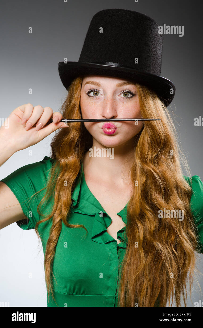 Woman magician wearing green dress Stock Photo - Alamy