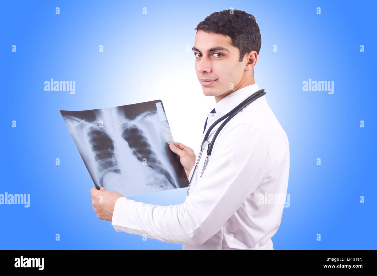 Young doctor with x-ray image on white Stock Photo - Alamy
