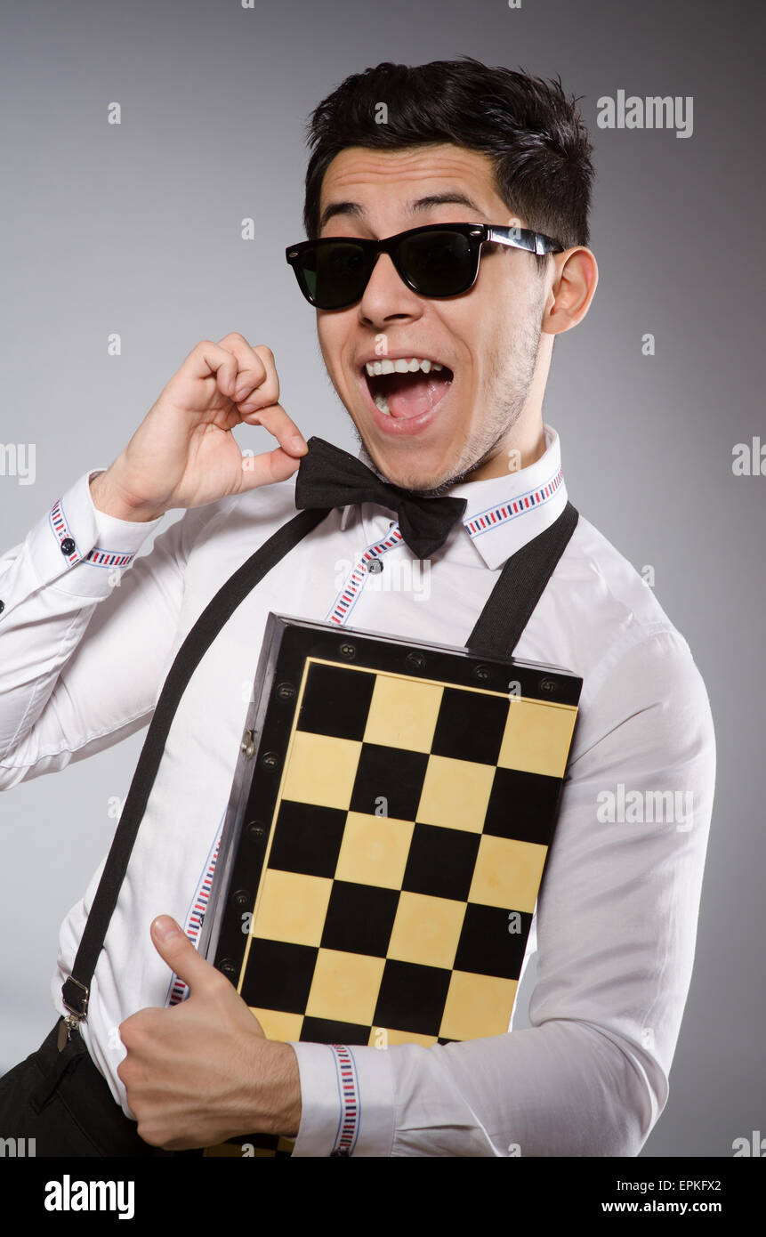 Funny chess player with board Stock Photo - Alamy