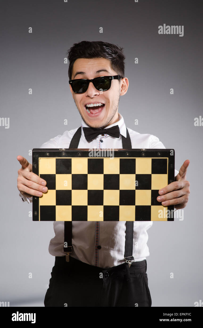 Funny chess player with board Stock Photo - Alamy